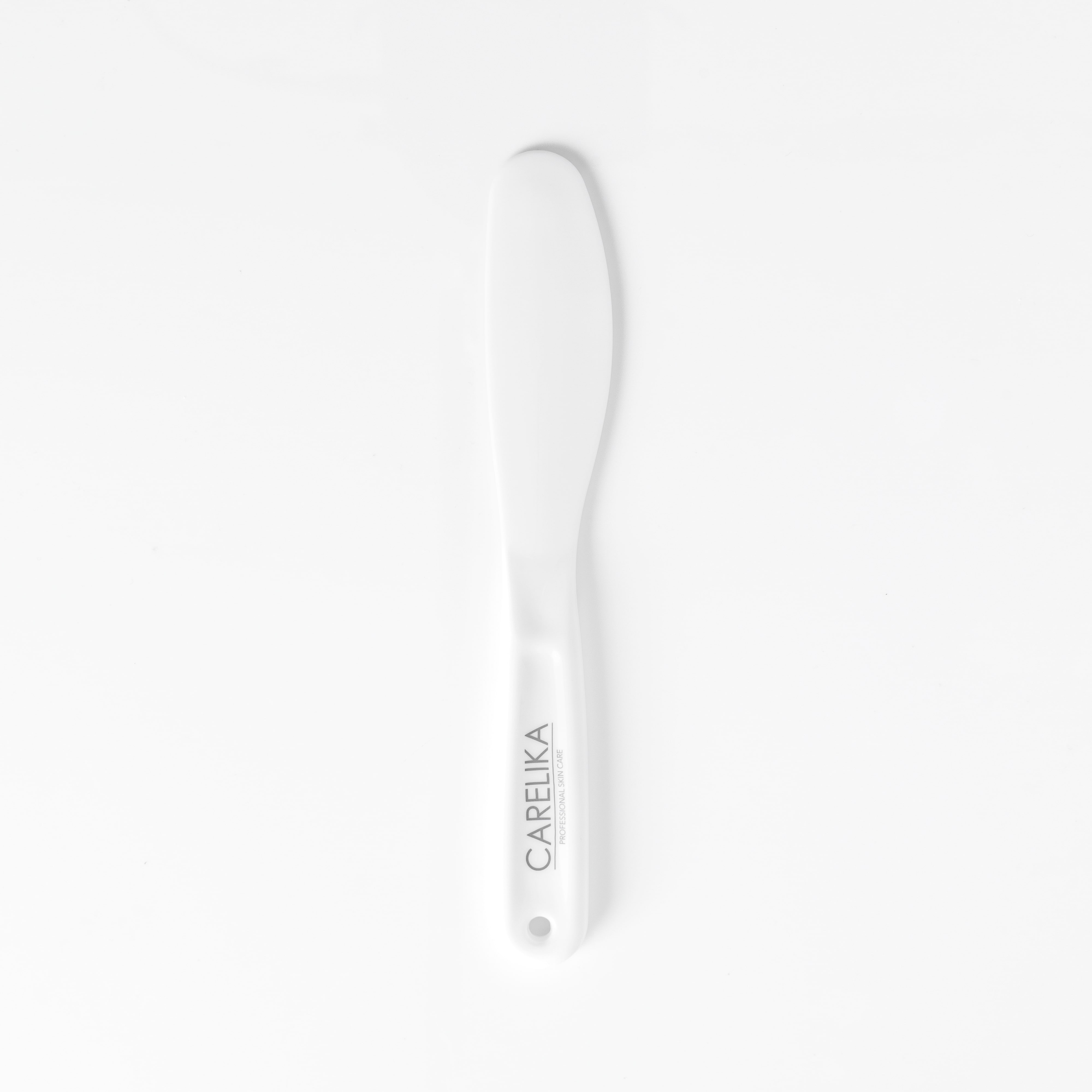 White Spatula for Applying a Face Mask